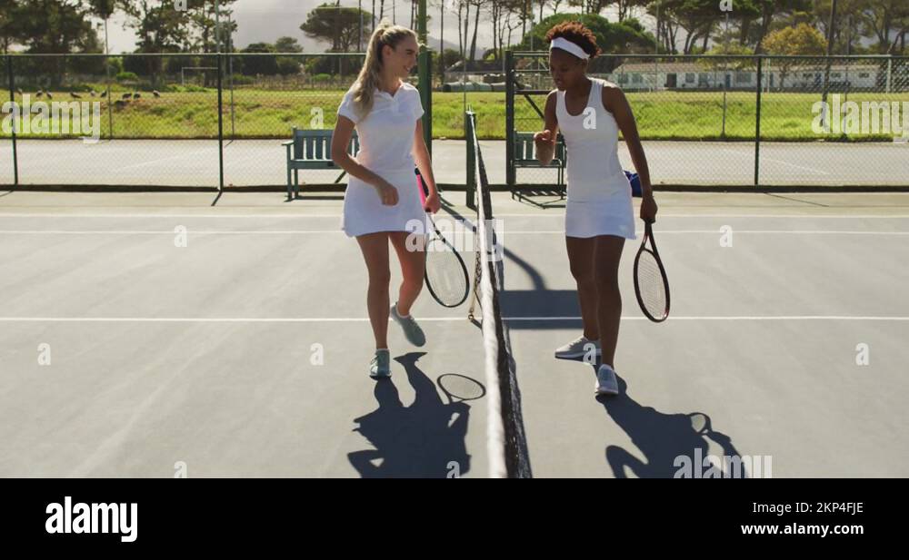 Video of happy diverse female tennis players holding rackets and ...