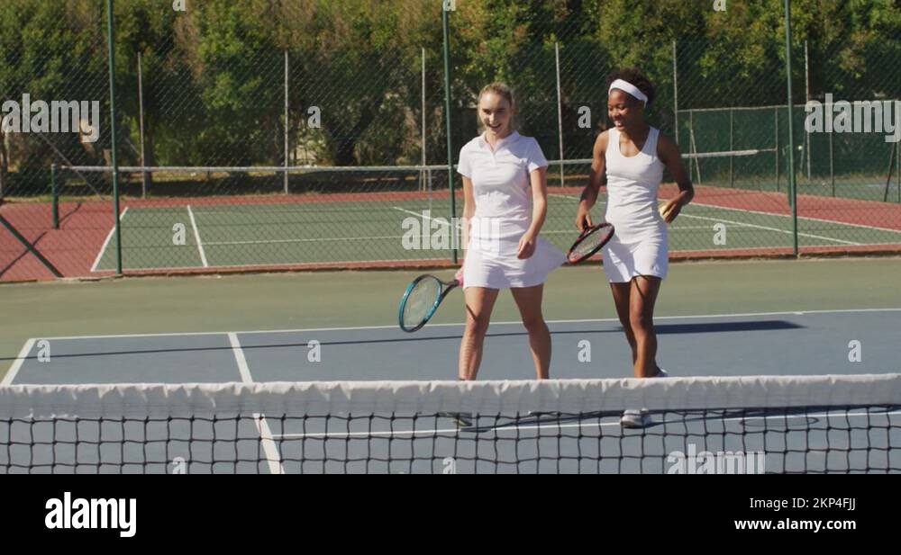 Video Of Happy Diverse Female Tennis Players Holding Rackets And