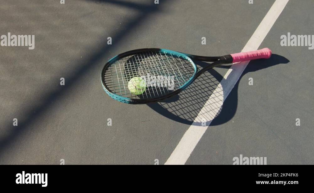 Video of tennis ball and racket lying on tennis court Stock Video ...