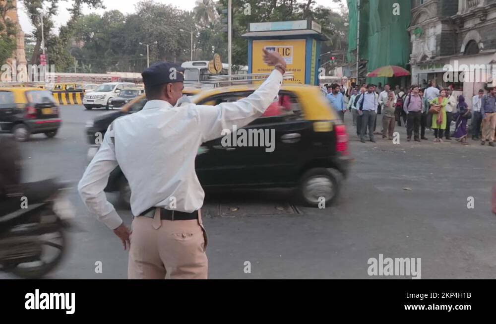 Indian state traffic police man standing by a roadside managing the ...
