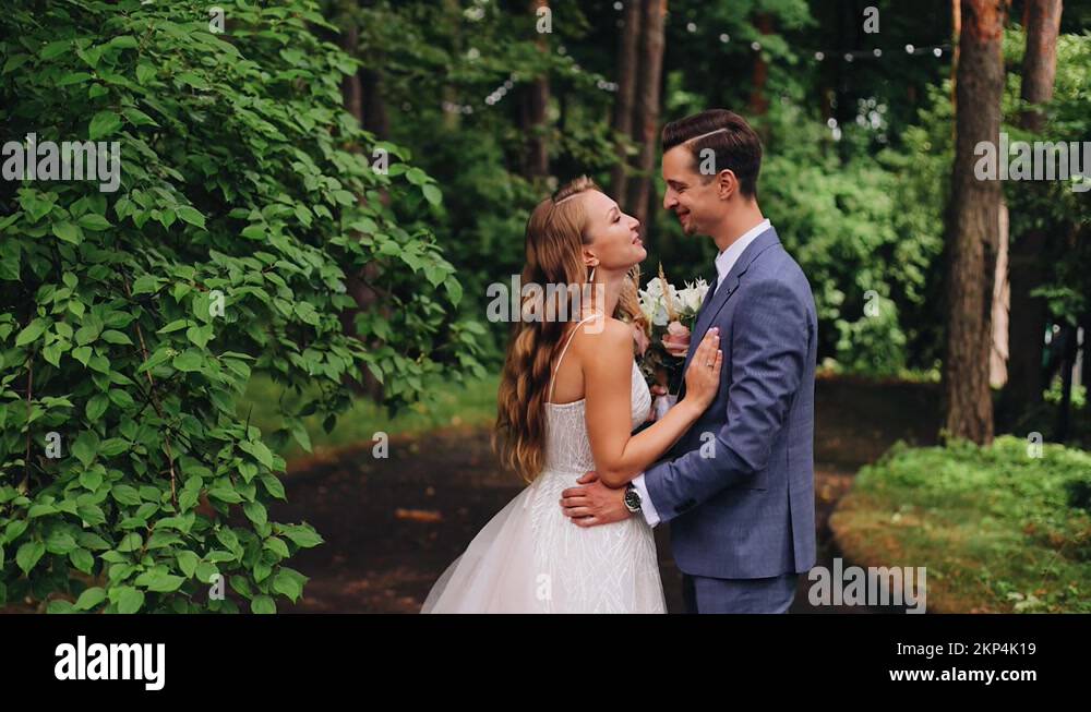 Two lovers kissing are standing opposite each other in the park Stock ...