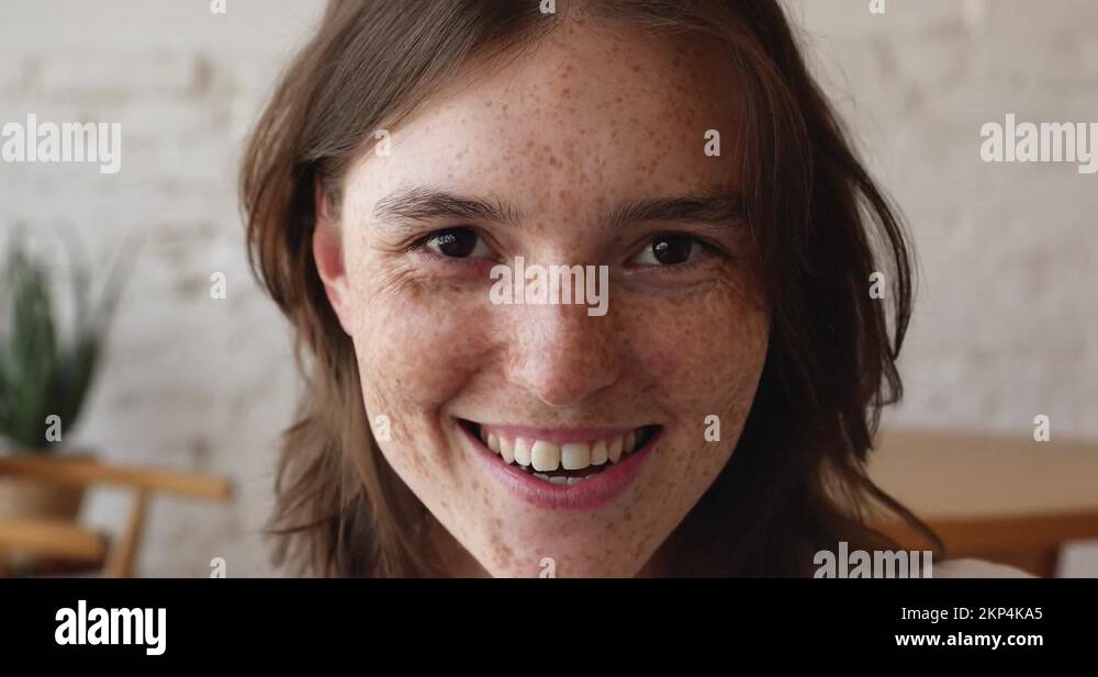 Closeup portrait of smiling pretty freckled face of teenage female ...