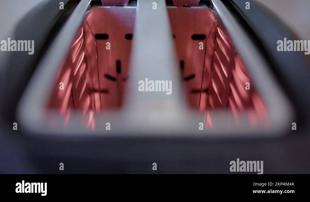 TRACKING, GLIDING, camera passes over a hot glowing toaster Stock Video ...