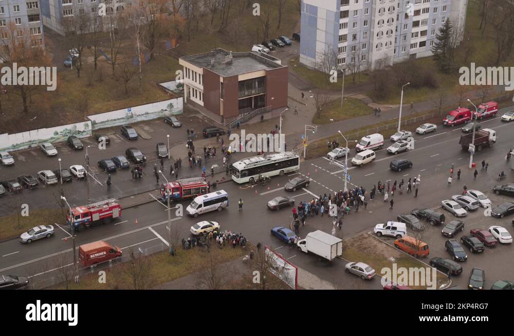 Trolley bus hit man, rescuers are trying to get victim. Top view of ...