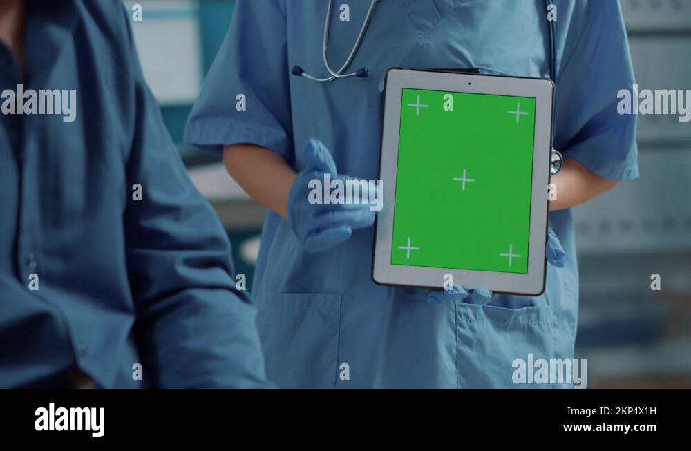 Nurse holding digital device with green screen template Stock Video ...