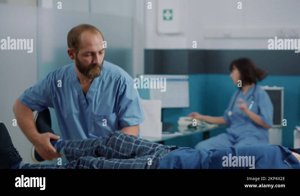 Physiotherapist using bones cracking procedure to cure senior patient ...