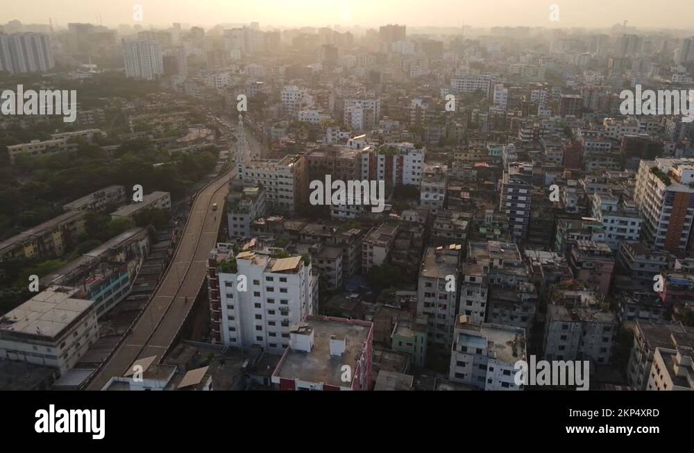 Dhaka huge cityscape at magical scenic sunset. Panning wide aerial ...