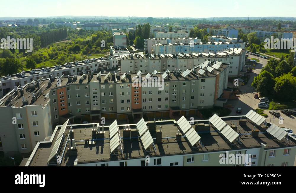 An array of solar Panels installed on the flat roofs of apartment ...