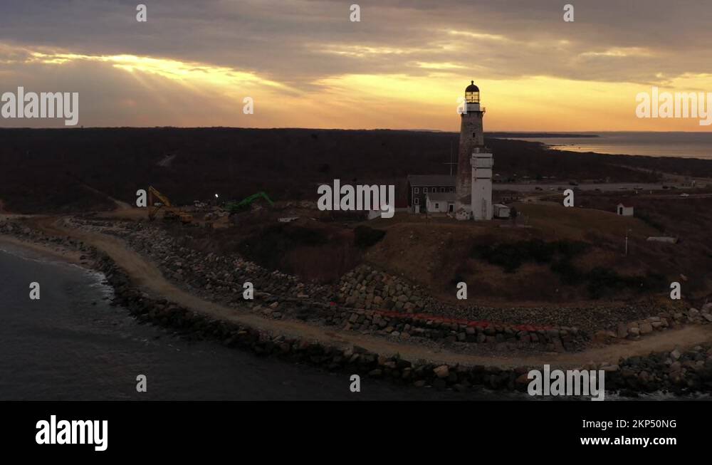 An aerial view of the Montauk lighthouse during a golden sunset. The ...