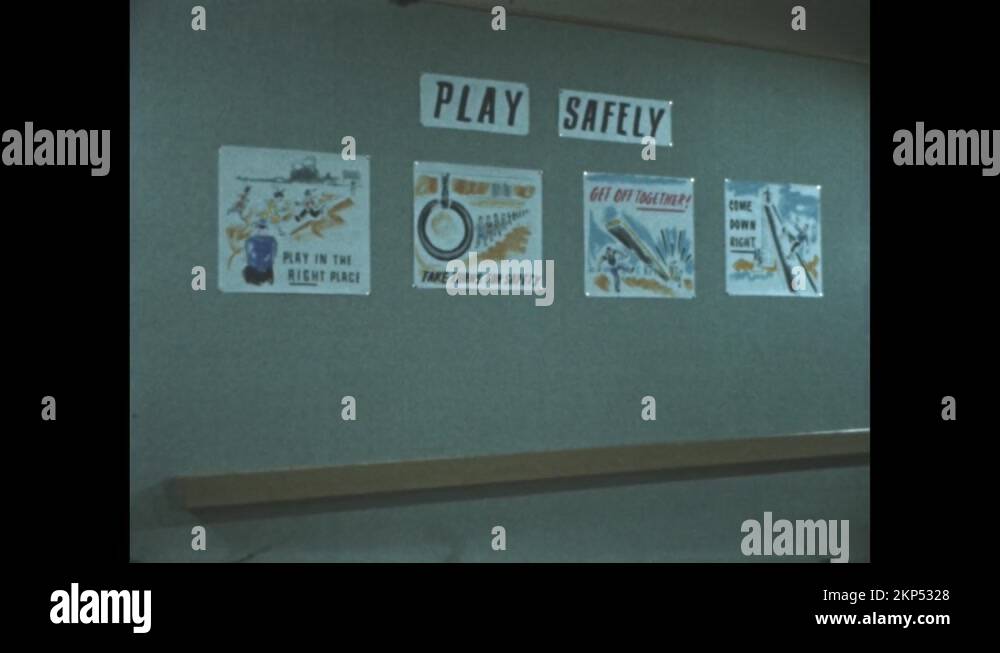 1950s: Children walk past school bulletin board posters, "Play Safely ...