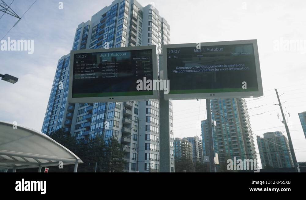 Bus terminal screens showing the schedule of bus arrivals. Sunny day ...
