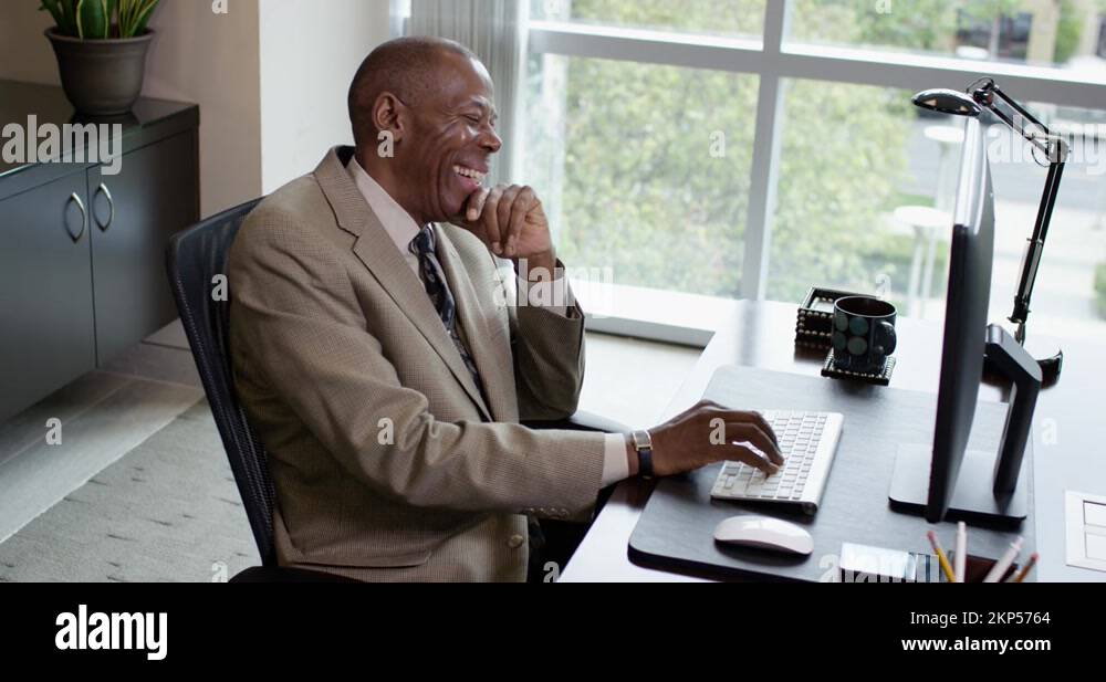 Happy Black Man Types and Laughs at Work Computer, 4K Stock Video ...