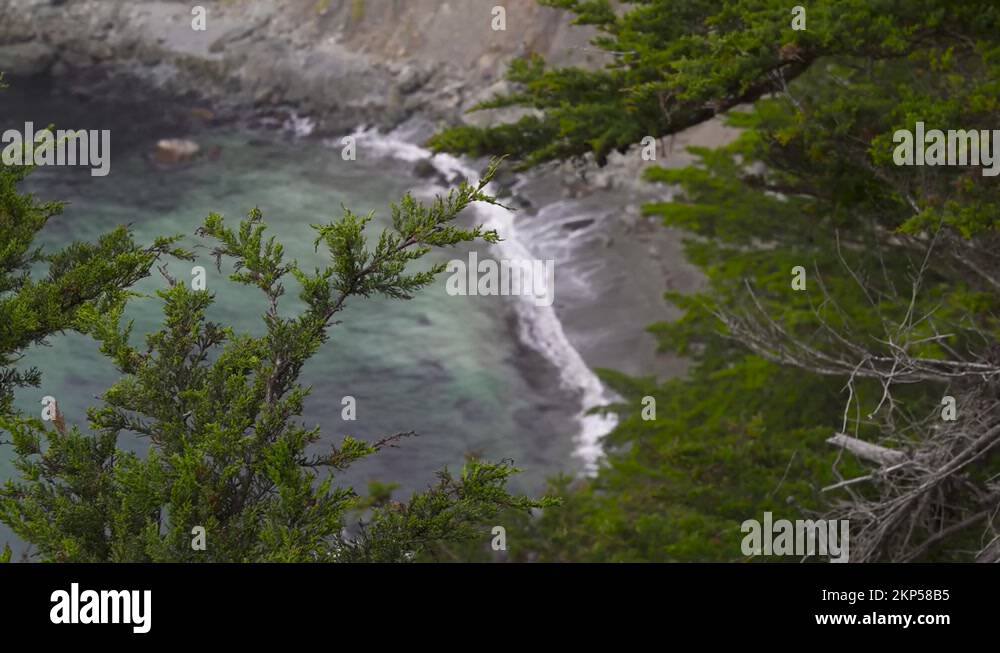 Edge of cliff at Big Sur, Central California. Ocean wave hitting rocky ...
