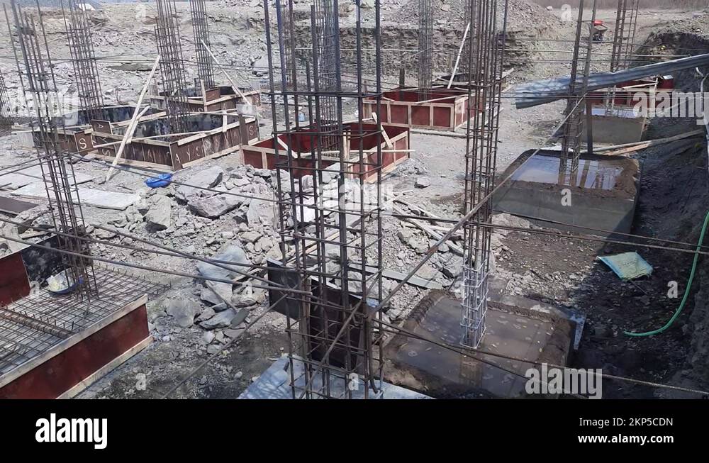 footage of laying PCC work on building basement construction site with ...