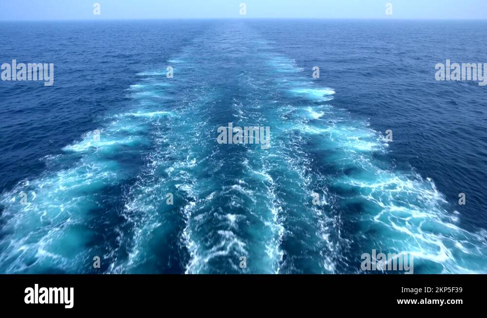 Wake of vessel. Wide wake trail from boat. Back view. Ocean water. Deep ...