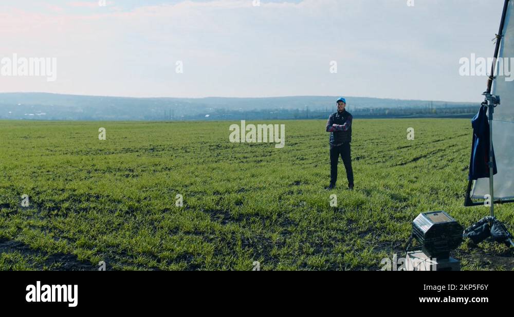 Behind the scene. Actor in front of the camera on the film set outdoor ...