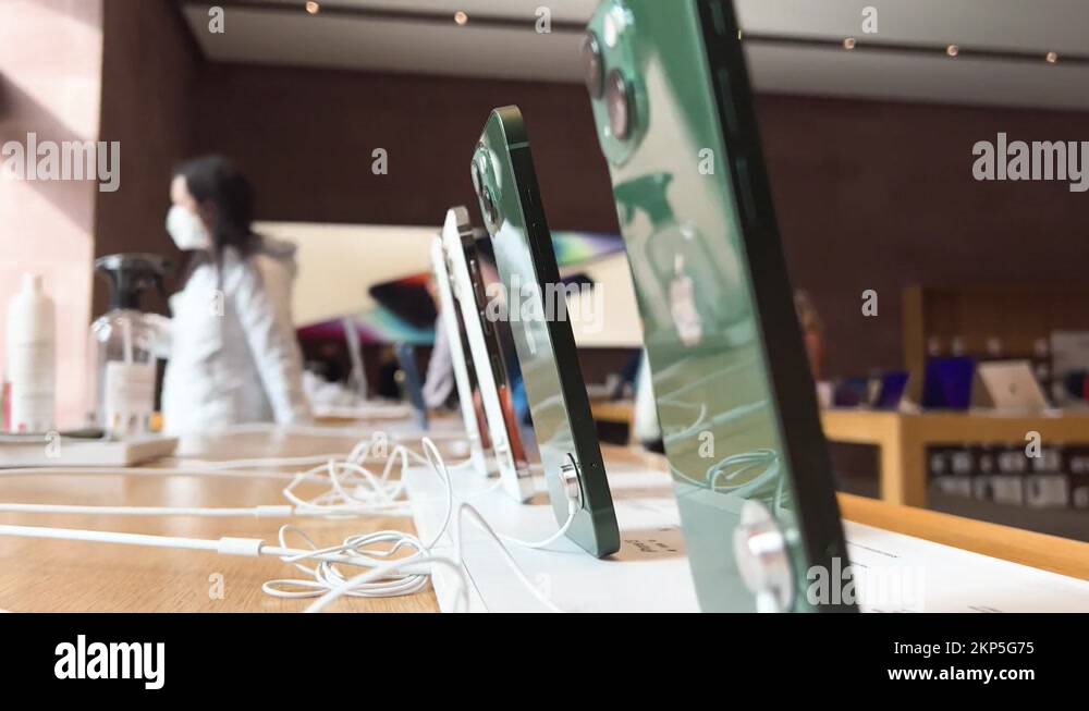 Rear view of new gorgeous green iPhone 13 and 13 Pro smartphones ...