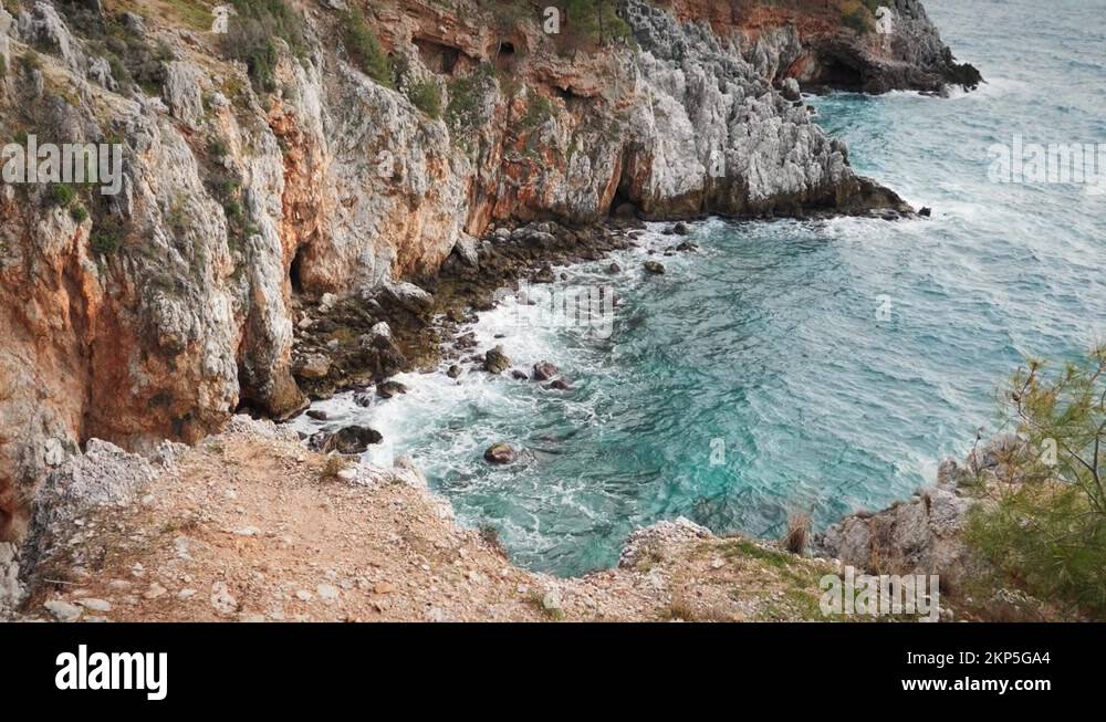 Coastline cliff with blue water lagoon. Crystal clear azure sea and ...