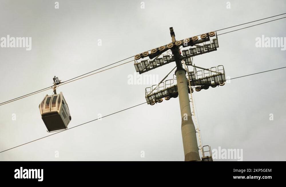 Rollers of cable car lift. Ski cabin lift gears. Wheels rotating cable ...