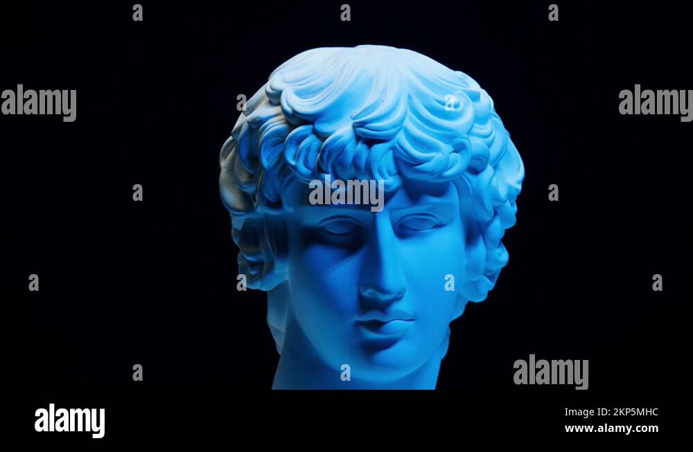 Plaster head sculpture Apollonian in blue neon light close-up. Gypsum ...