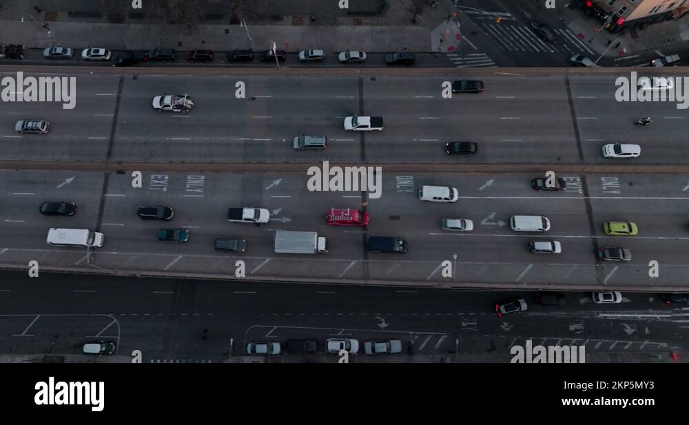 Vehicular intersection, traffic at peak hour with cars on the road ...