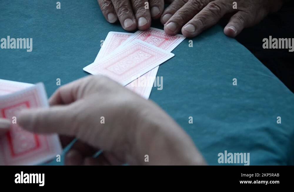 Close up of hands dealing cards for a fun card game Stock Video Footage ...