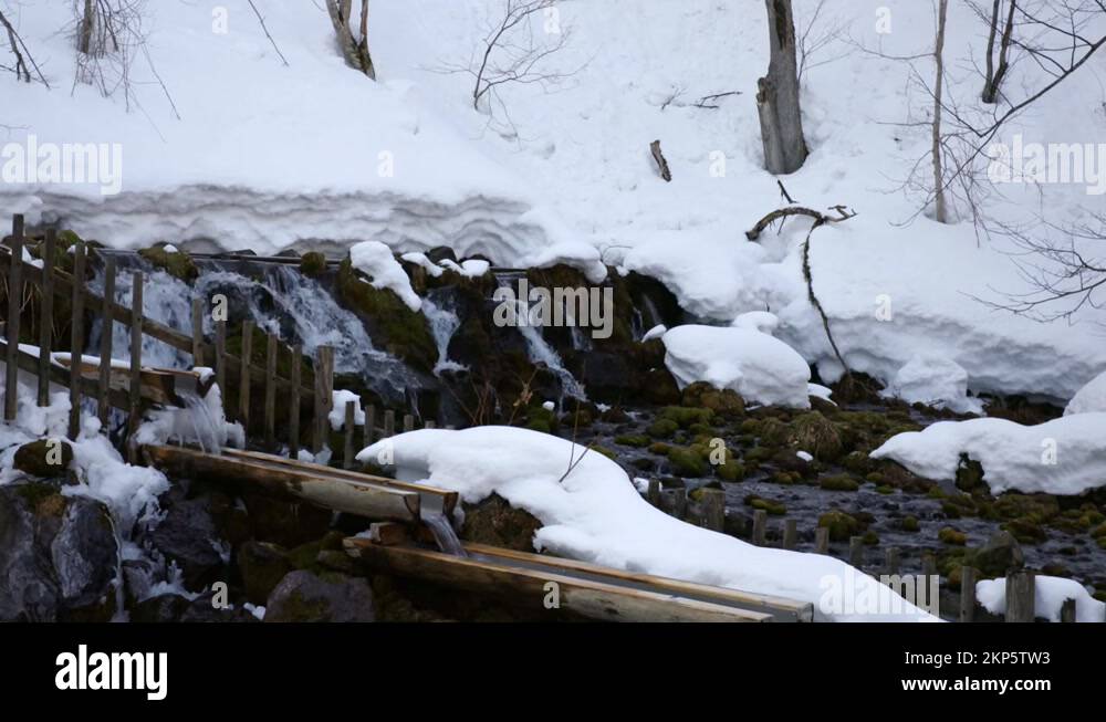Slowly flowing water from the Kyogoku waterfalls in Fukidashi park ...