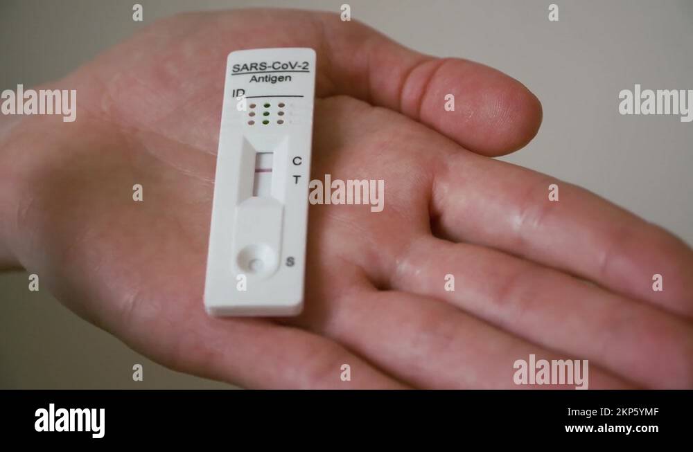Woman change negative fast antigen test cassette with reagents for ...