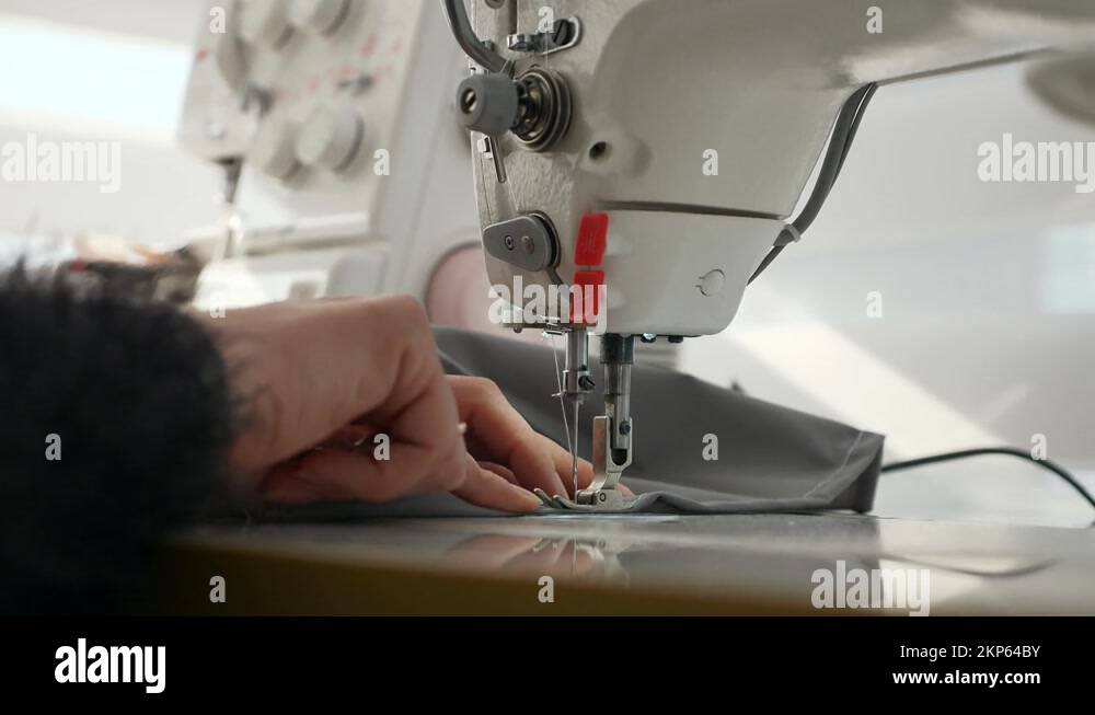 Woman Sew Working on Electric Sewing Machine. Female Seamstress Work at ...