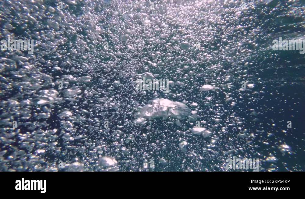 Slow motion of air bubbles floating from sea bottom to the water ...