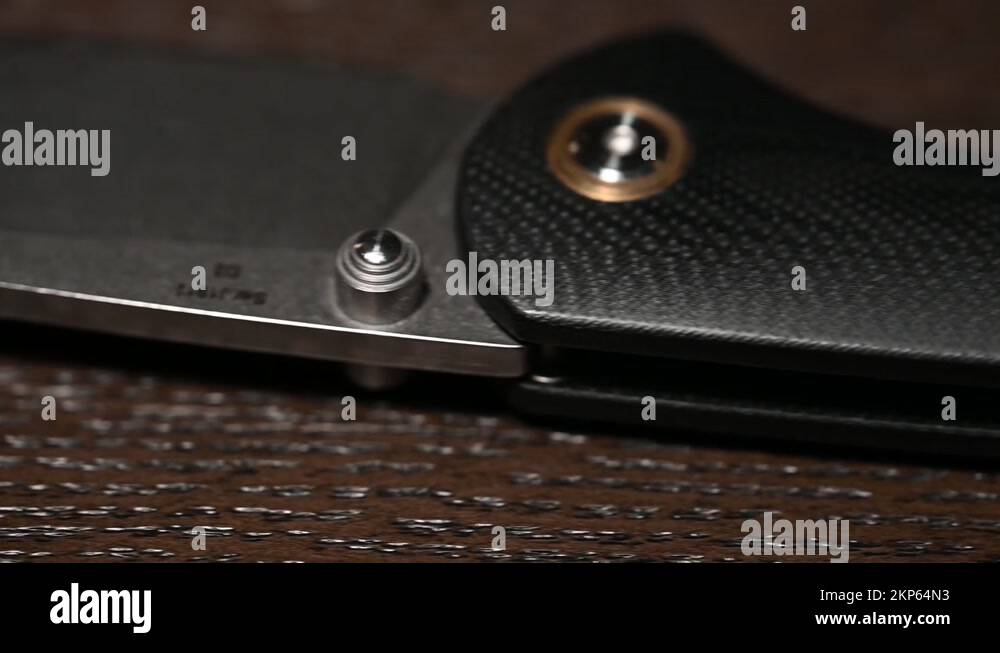 slow slide over an open blade tactical knife with high-end closure ...