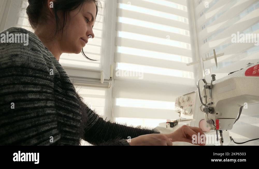 Woman Sew Working on Electric Sewing Machine. Female Seamstress Work at ...