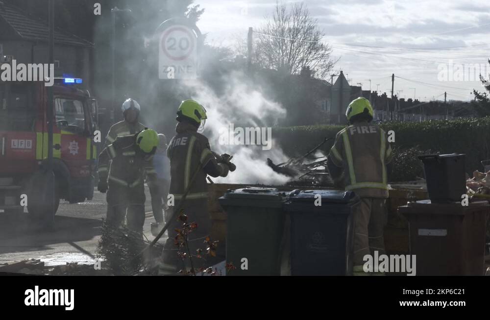 London Fire Brigade Firefighters Checking Material From Burnt Skip Fire ...
