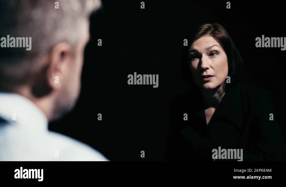 Police detective questioning woman in custody about illegal drugs ...