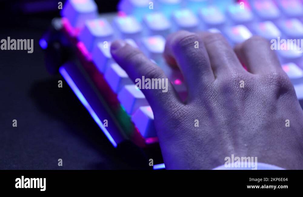 Young man hand using the W, A, S, D keys of a mechanical keyboard with ...