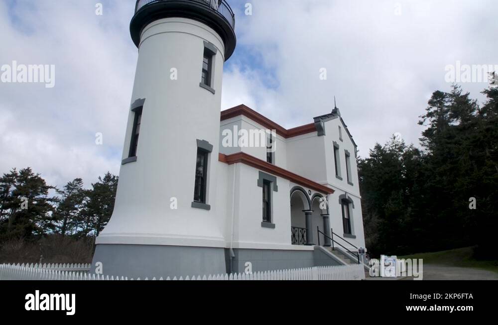 Slow motion tilt down of a restored lighthouse at Fort Casey in ...
