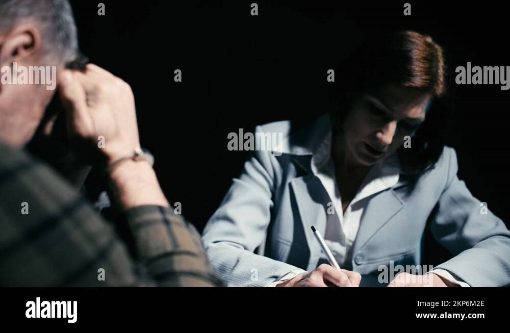 Female police detective questioning man in handcuffs, suspect crying ...