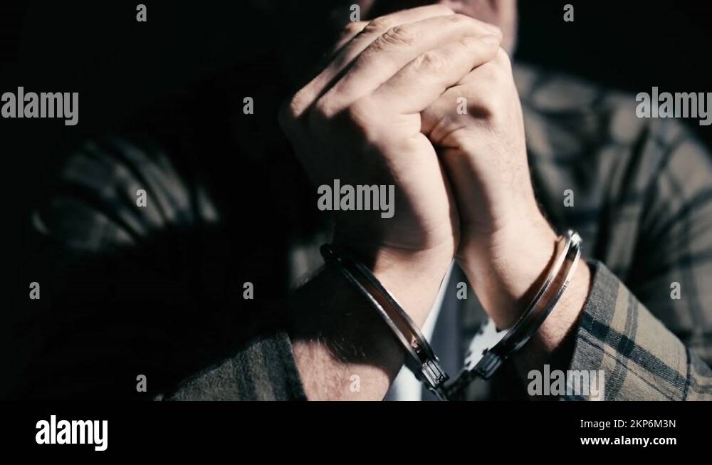 Scared man in handcuffs interrogated by police, investigation ...