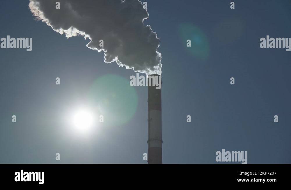 Smoke stack with smoke emission. Plant pipes pollute atmosphere ...