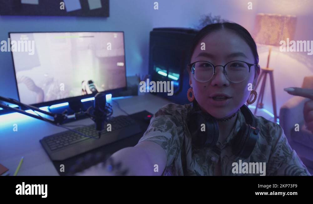 POV of Teenage Girl Making Live Stream while Playing FPS Game Stock ...