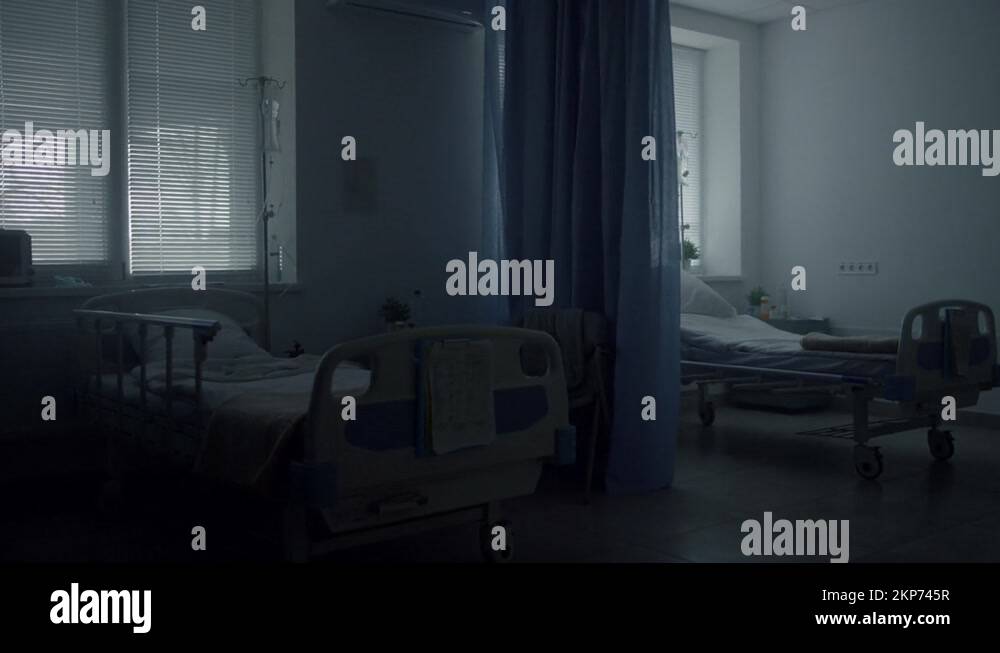 Dark empty hospital room interior with abandoned neat beds shuttered ...