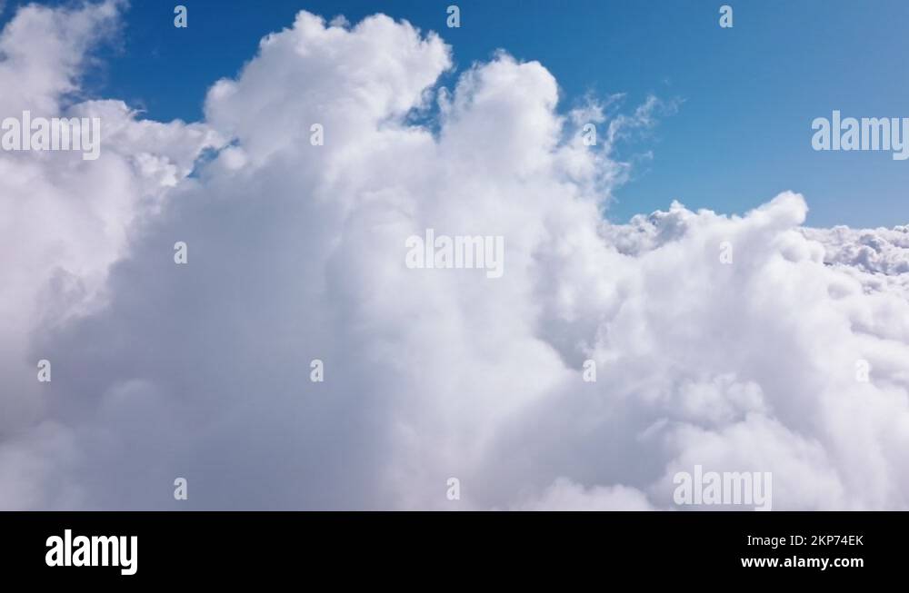 Airplane window view time lapse clouds in blue sunny sky, Scenic white ...