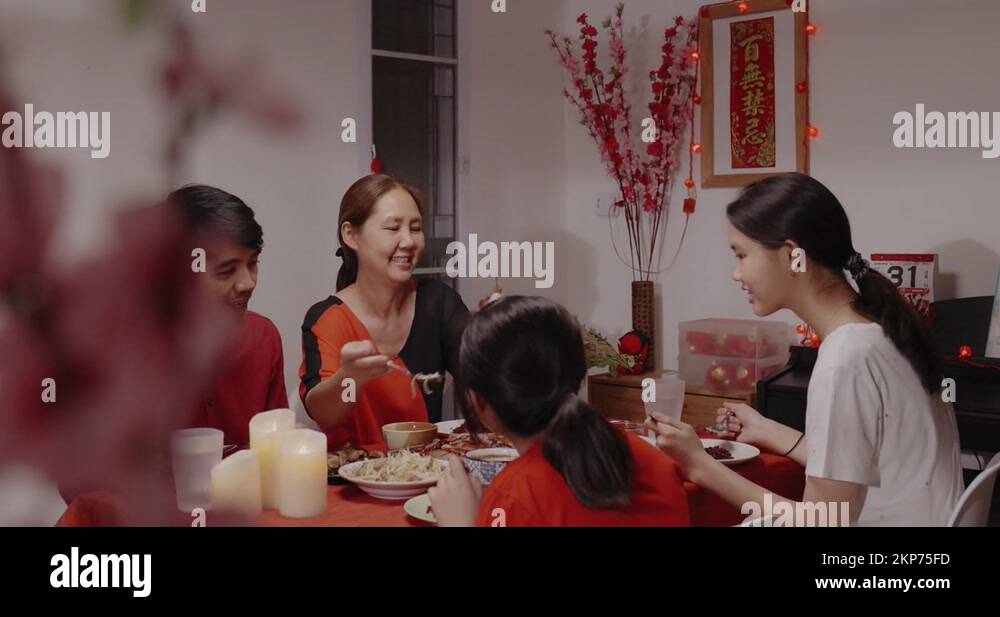 Asian family members enjoying Asia food together while having reunion ...