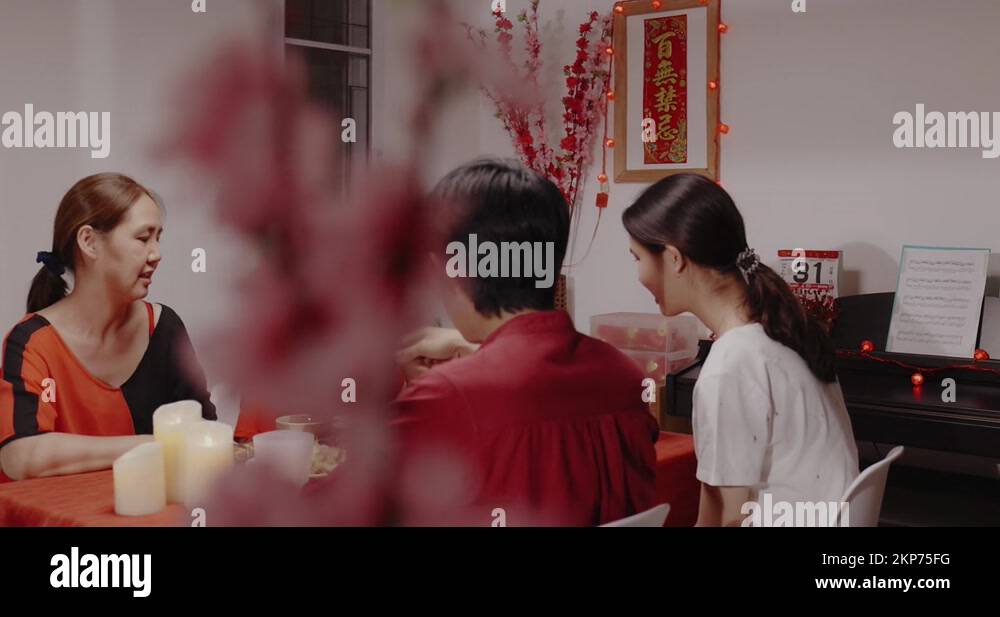 Asian family members enjoying Asia food together while having reunion ...