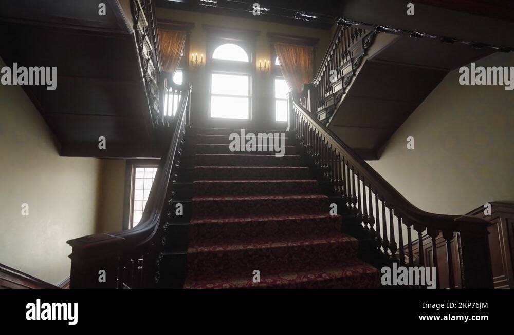Old Grand Staircase in a 1900's Mansion with Sun Peaking Through ...