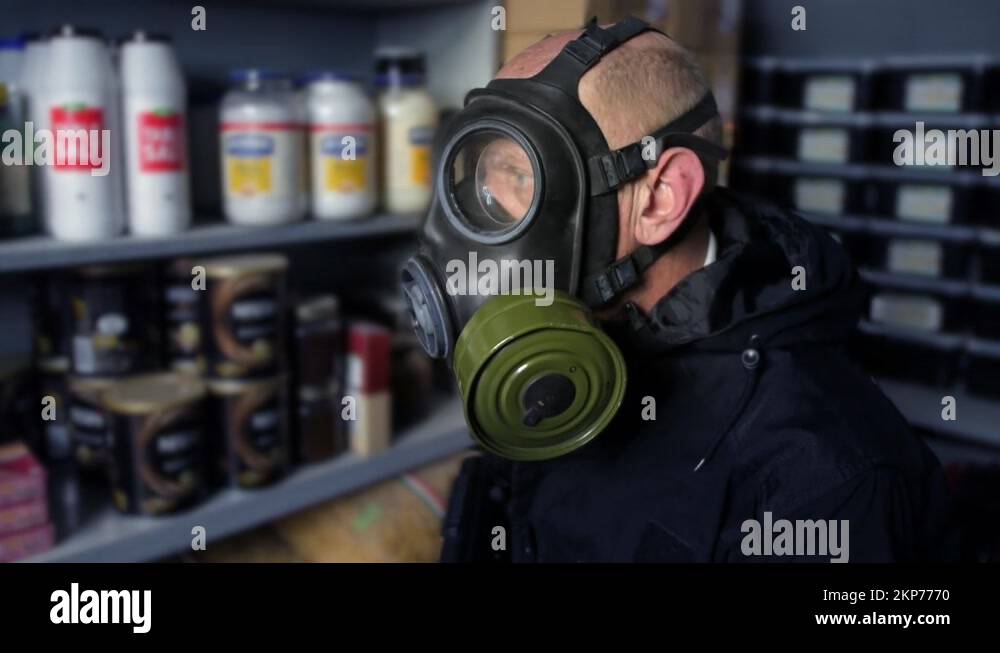Doomsday prepper sitting in a fallout bunker wearing a gas mask and ...