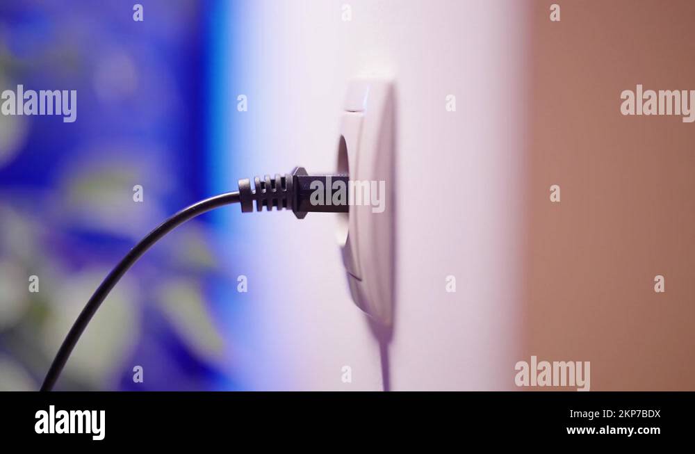 Plug in and plug out thin black cable with thick head close-up 4K Stock ...