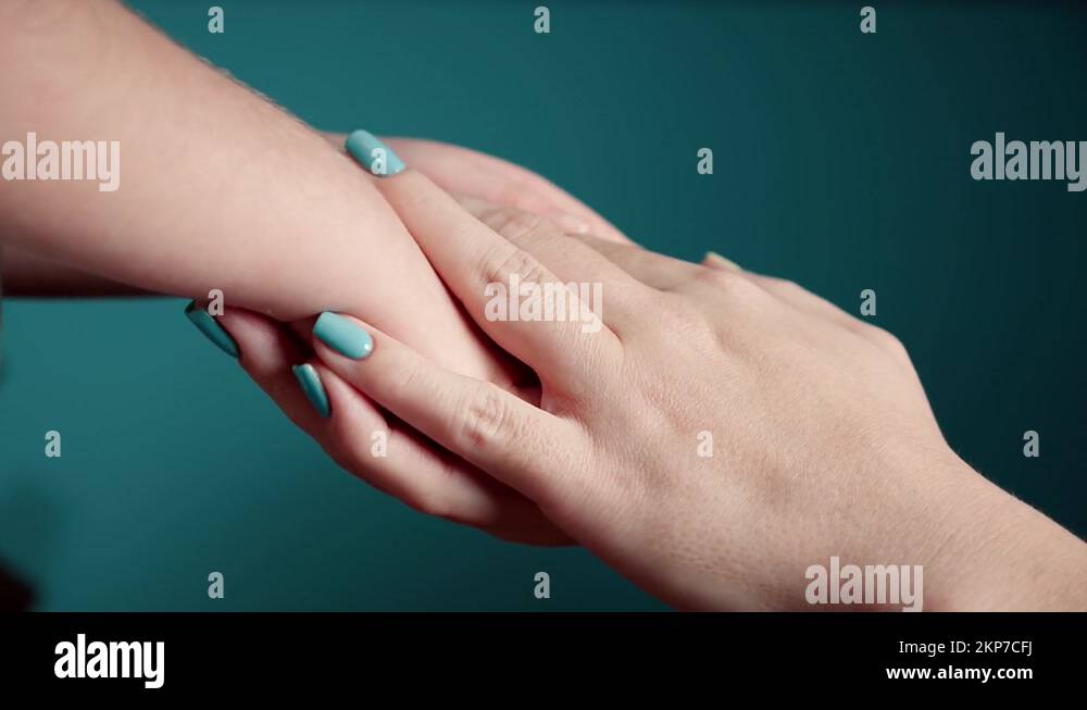 Mother and son are holding hands. Mom holds the hand of her little son ...