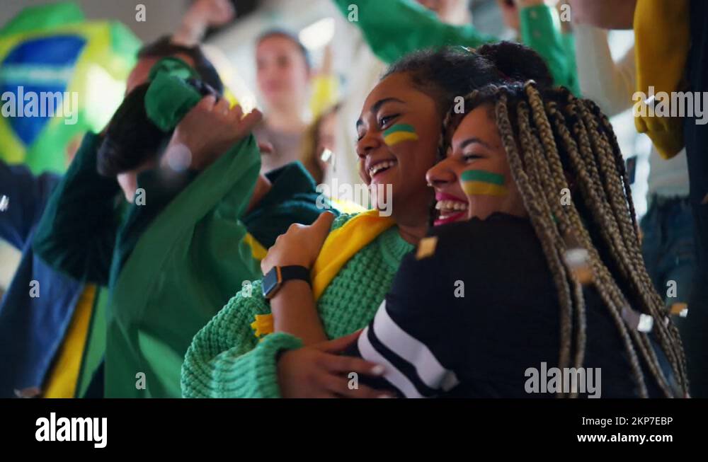 Brazilian young football fans celebrating their team's victory at ...