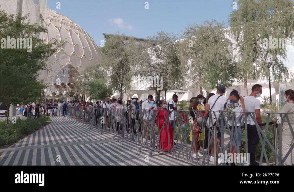 A large queue of people at the entrance to the pavilion at Dubai Expo ...